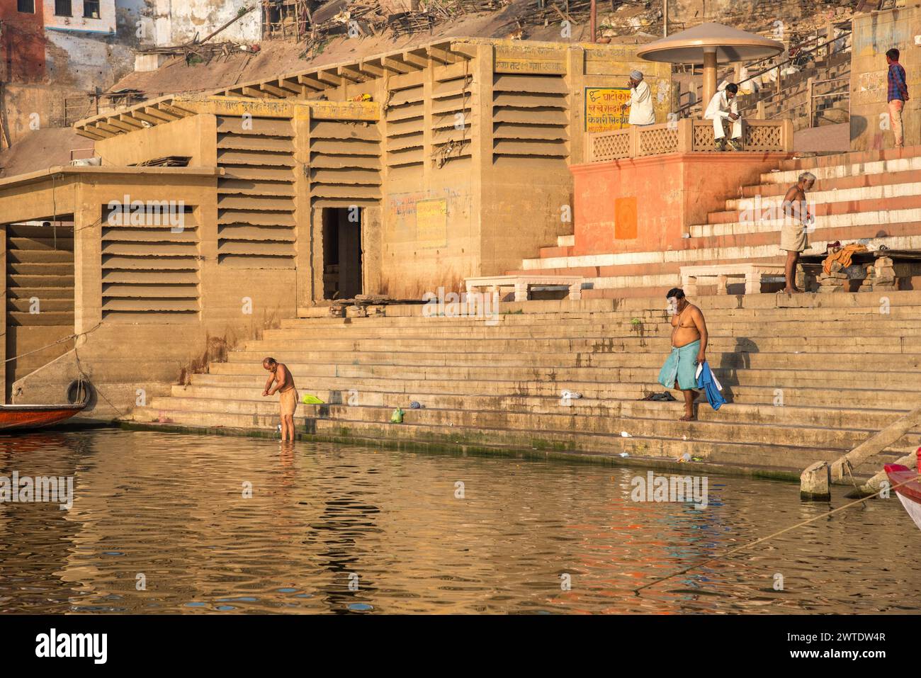 India people at the ghats and riverbank of sacred Ganges river for ...