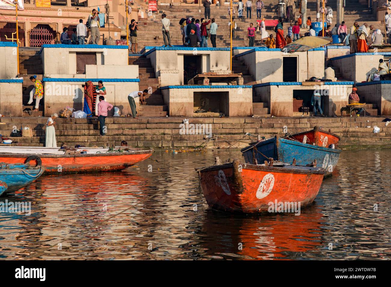 Wooden boats at Iat riverbank of sacred Ganges river in the morning ...