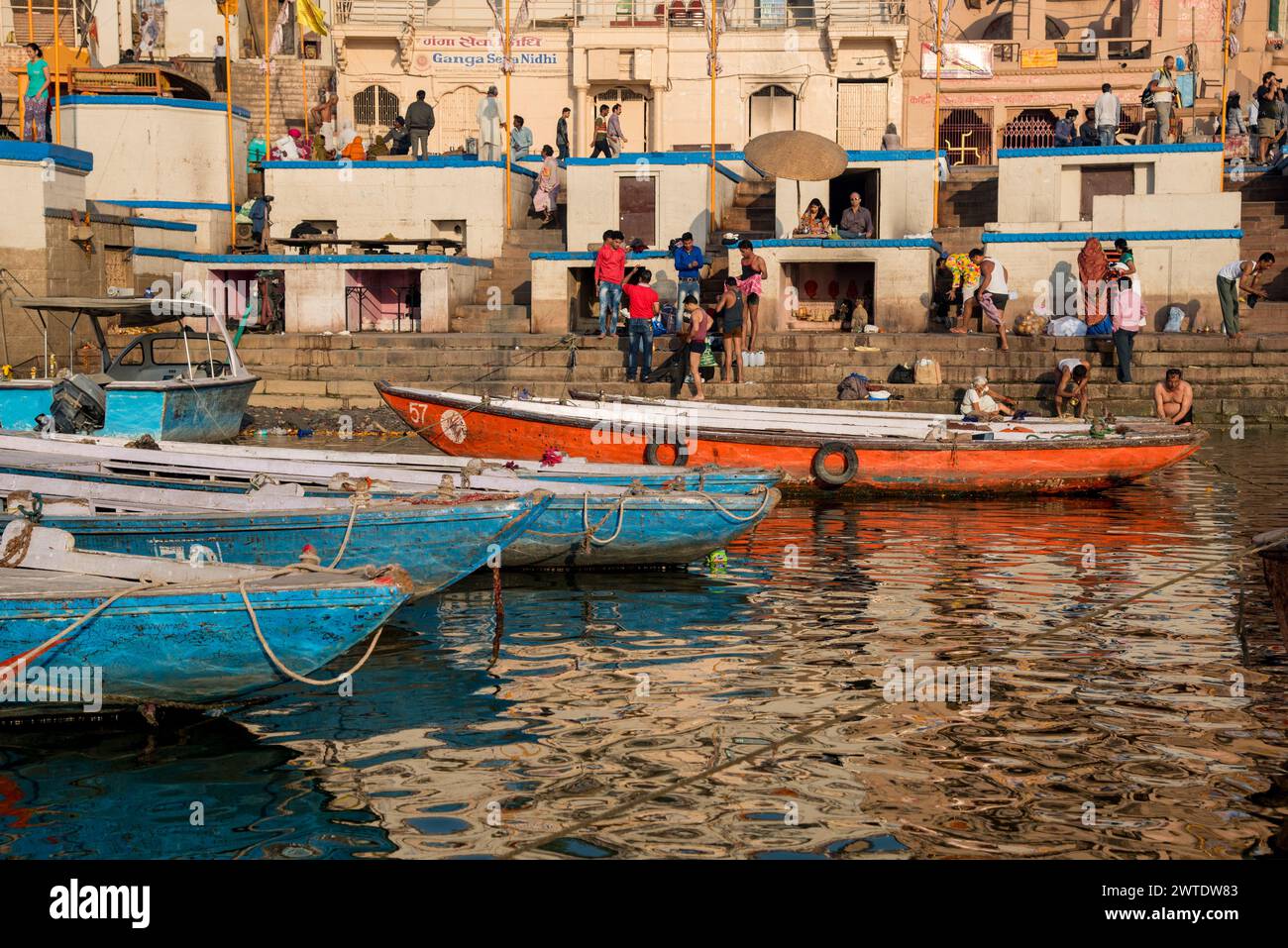 Wooden boats at Iat riverbank of sacred Ganges river in the morning ...