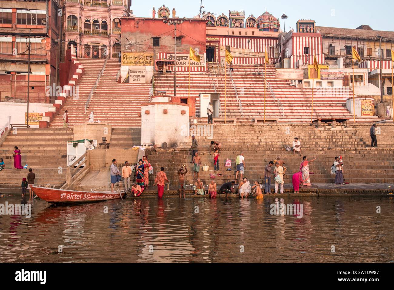 India people at the ghats and riverbank of sacred Ganges river for ...