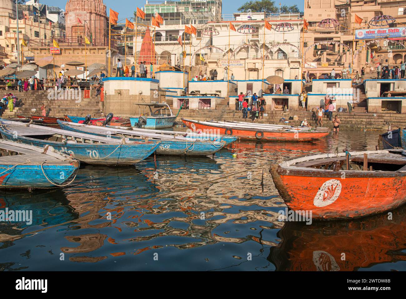 Wooden boats at Iat riverbank of sacred Ganges river in the morning ...