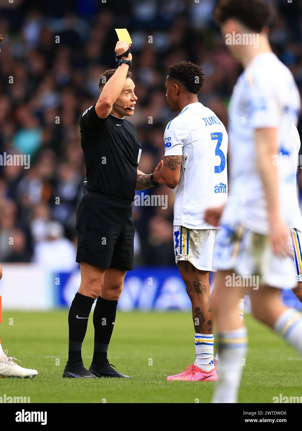 Leeds, UK. 17th Mar, 2024. Junior Firpo of Leeds United receives a ...