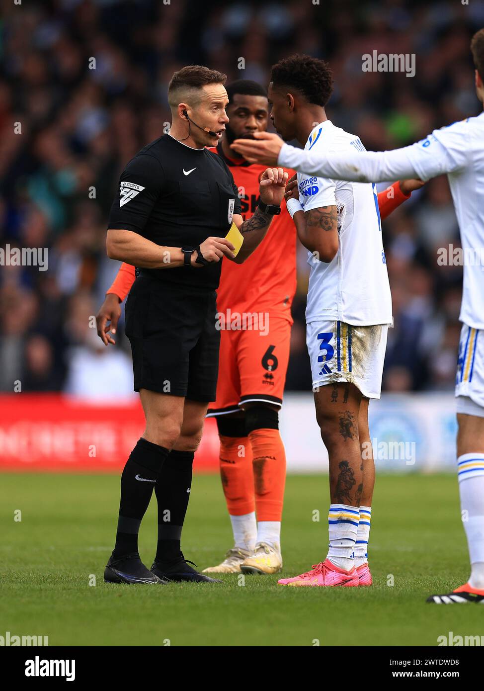 Leeds, UK. 17th Mar, 2024. Junior Firpo of Leeds United receives a ...
