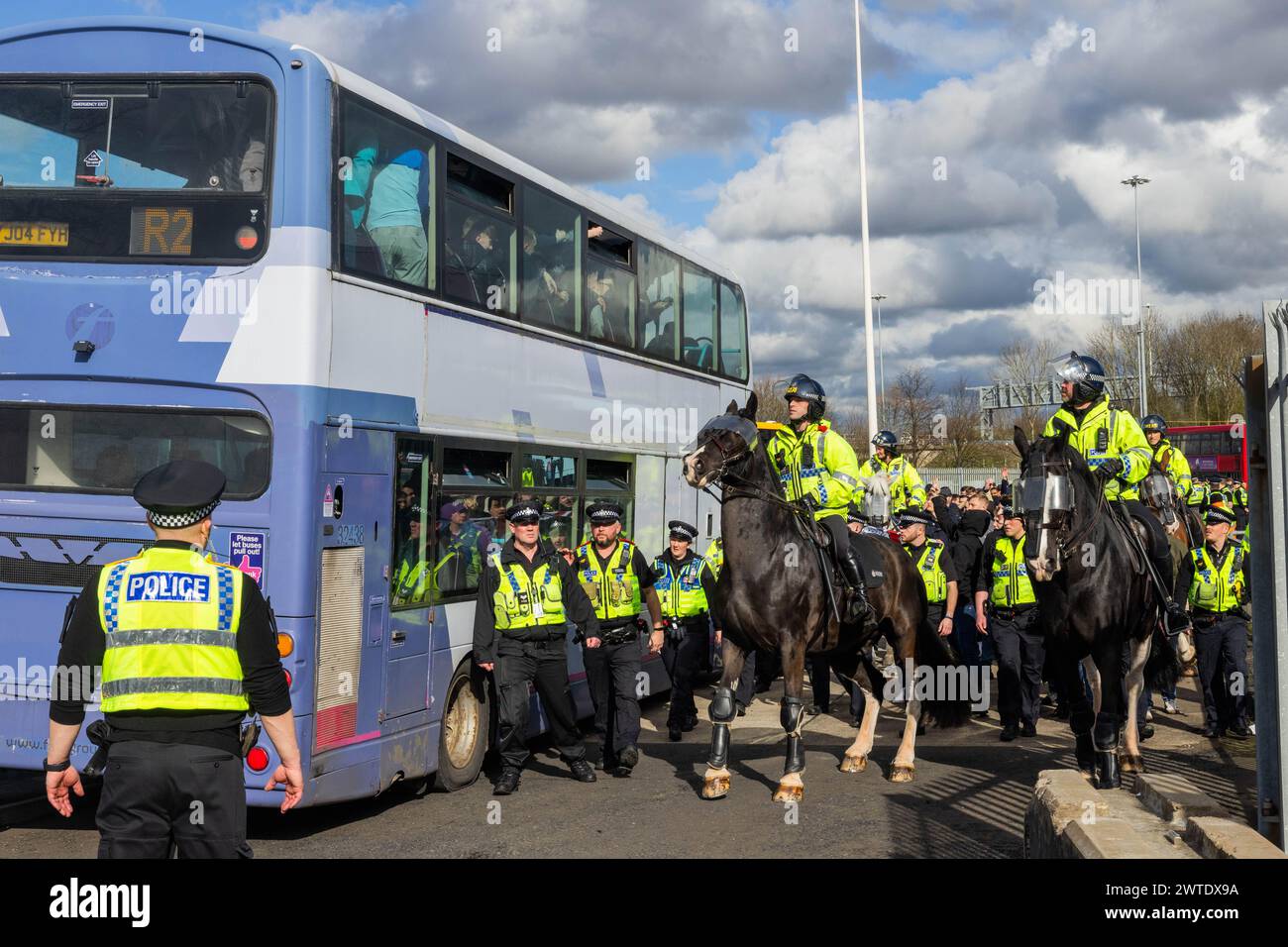 Leeds, UK. 17 MAR, 2024. Millwall fans clash with pro Leeds United bus ...