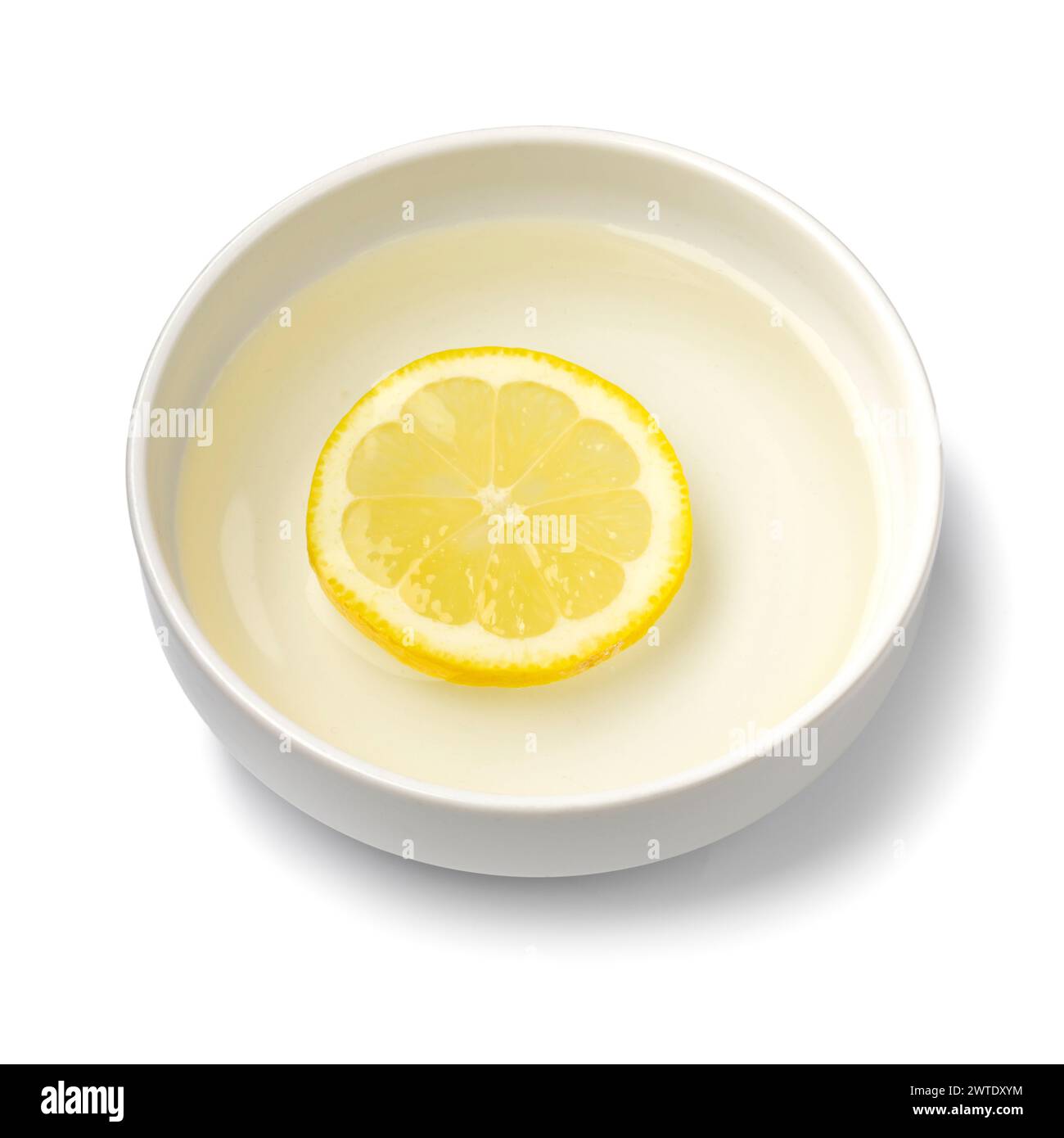 Single white bowl with water and lemon slice for washing hands isolated ...