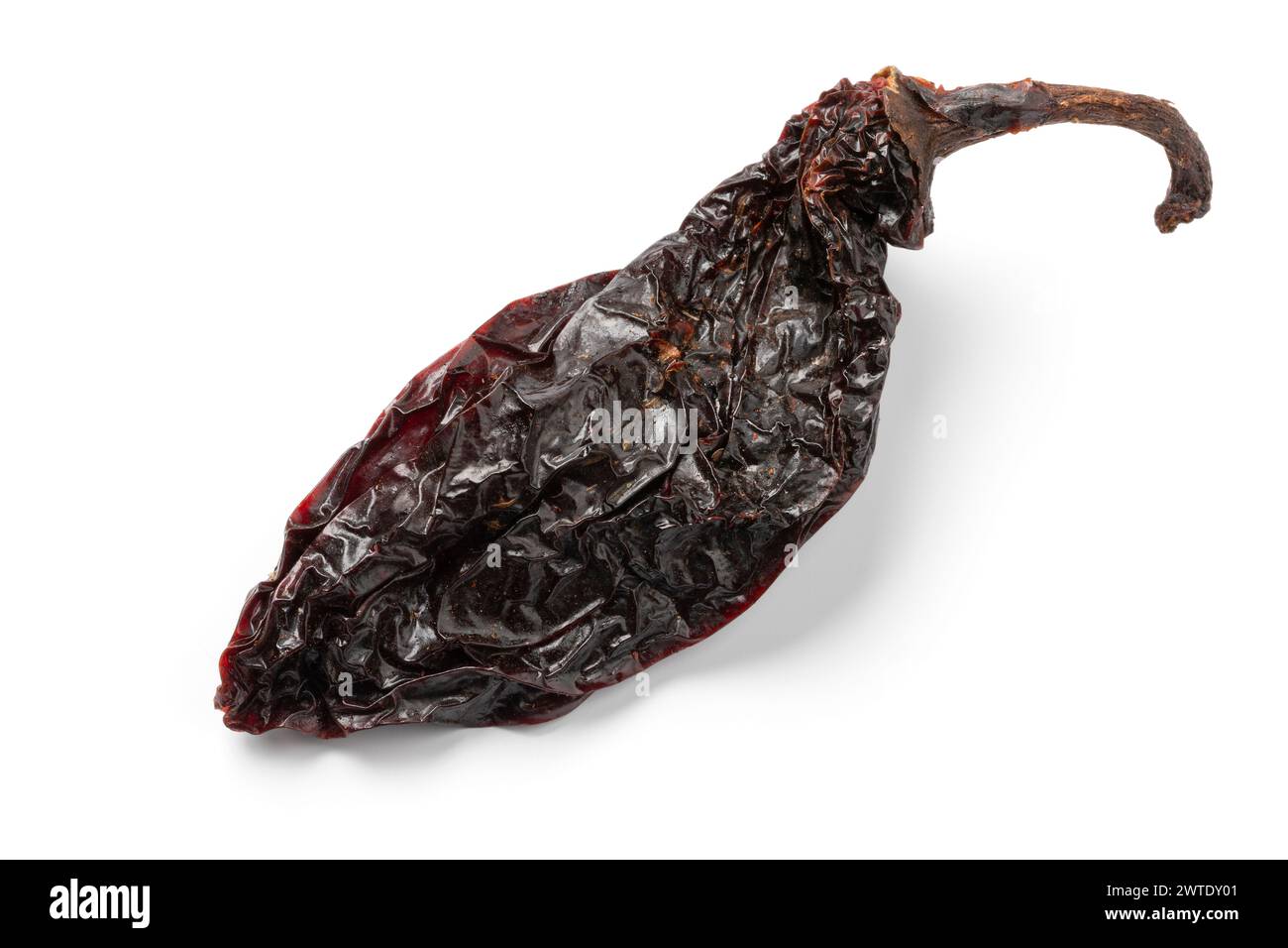 Single dried smoked Mexican chipotle pepper isolated on white ...
