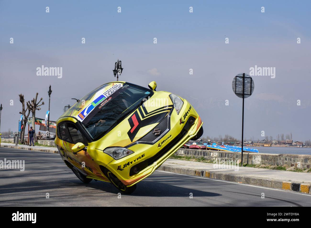 Srinagar, India. 17th Mar, 2024. A professional driver performs a car stunt during a motorsport ...