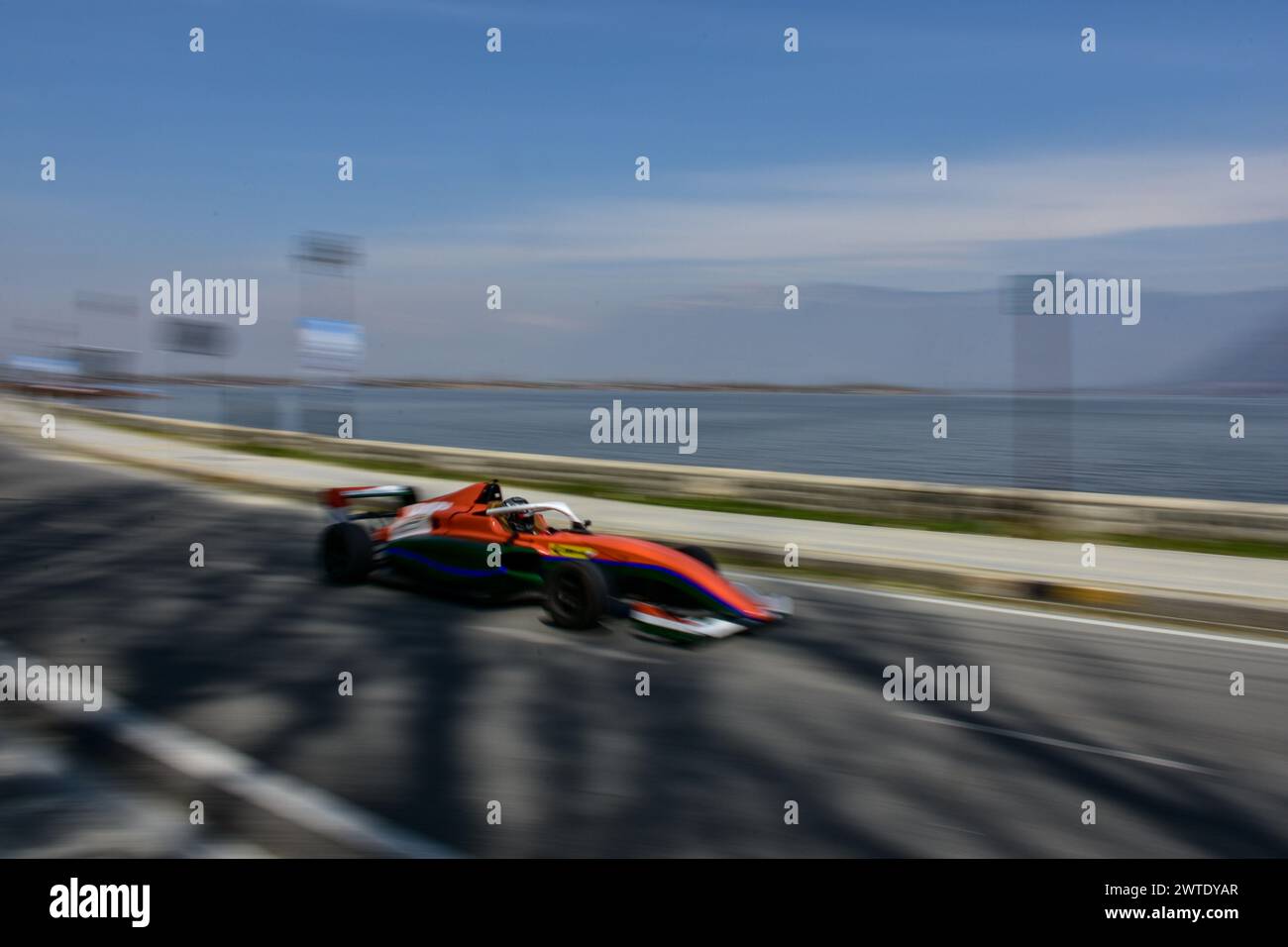 Srinagar, India. 17th Mar, 2024. A racing car moves along the road during a motorsport event ...