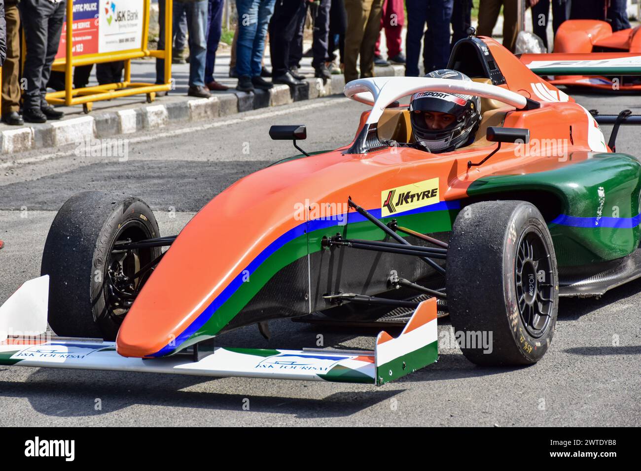 Srinagar, India. 17th Mar, 2024. A racing car moves along the road during a motorsport event ...