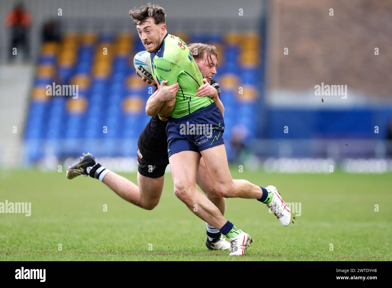 Warrington Wolves' Matty Ashton is tackled by London Broncos' James ...