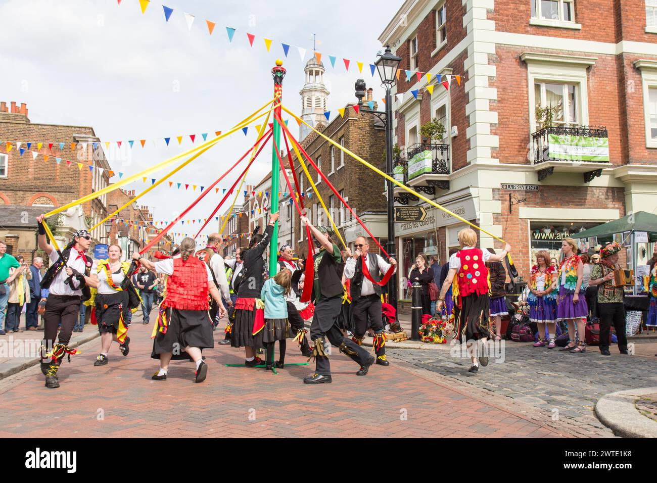 Morris dancing around the May pole at the Sweeps Festival in Rochester ...