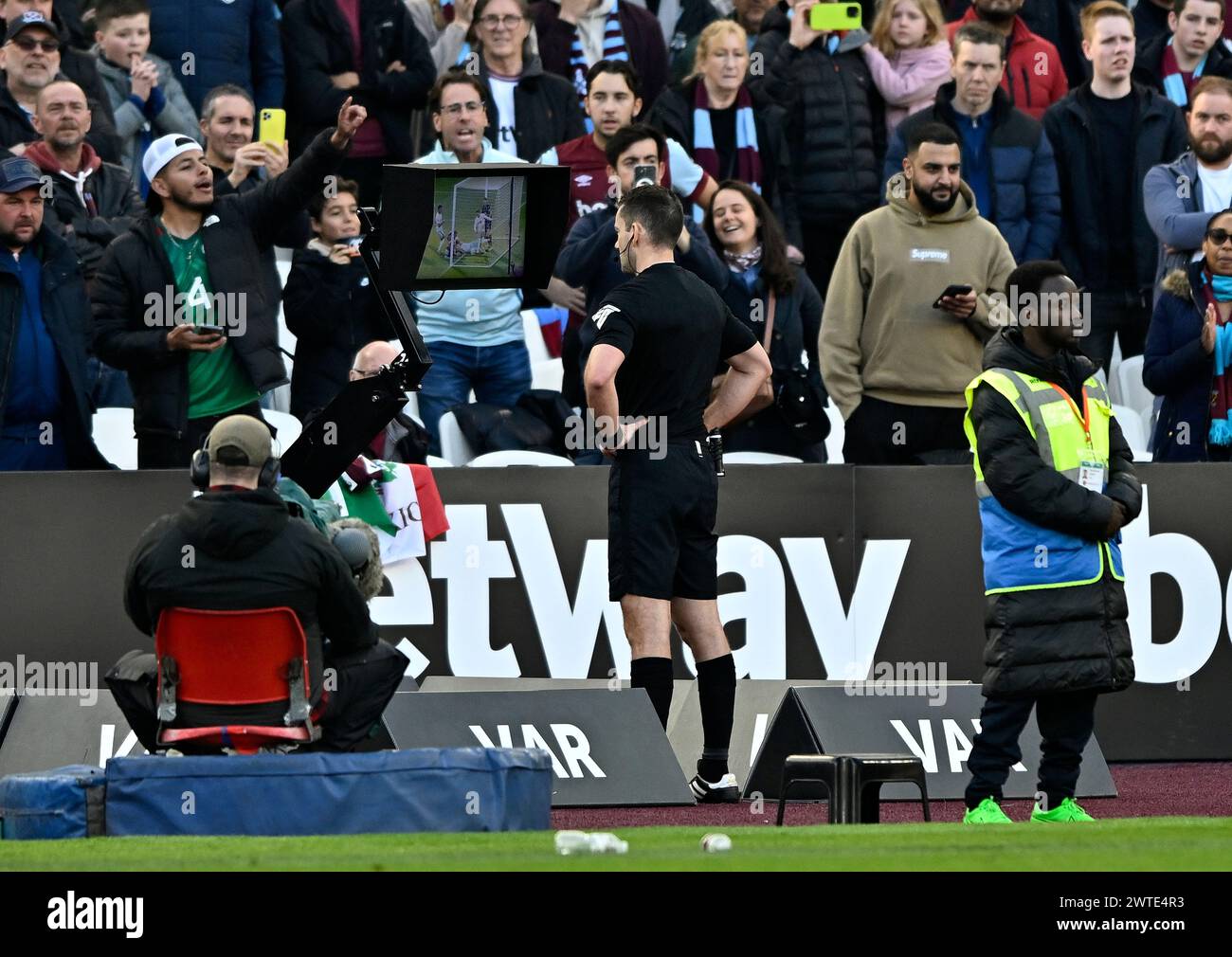 London, UK. 17th Mar, 2024. Jarred Gillet (Referee) looks at the VAR ...