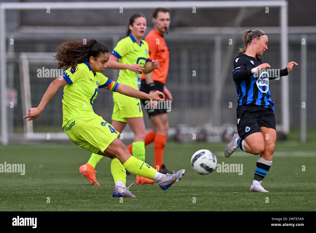 Nia Elyn (4) of AA Gent and Fleur Pauwels (17) of Club YLA pictured during a female soccer game ...