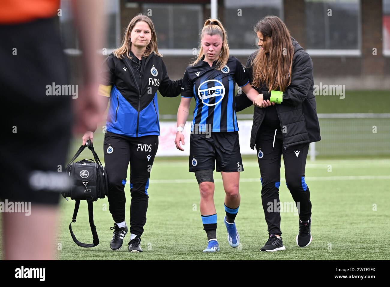 Aalter, Belgium. 16th Mar, 2024. Lyndsey Van Belle (99) of Club YLA pictured injured with an ...