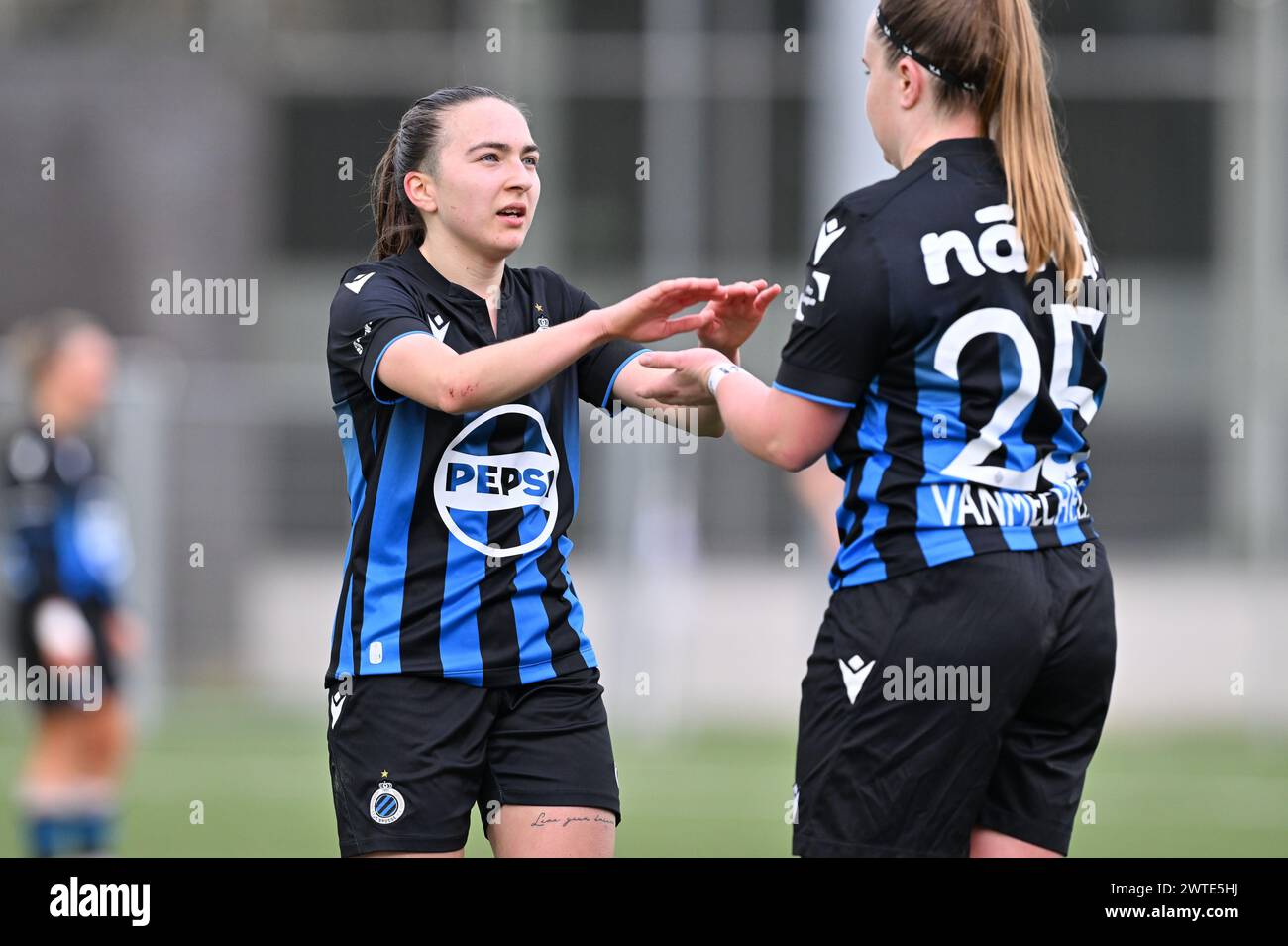 Aalter, Belgium. 16th Mar, 2024. Angel Kerkhove (13) of Club YLA and Davinia Vanmechelen (25) of ...