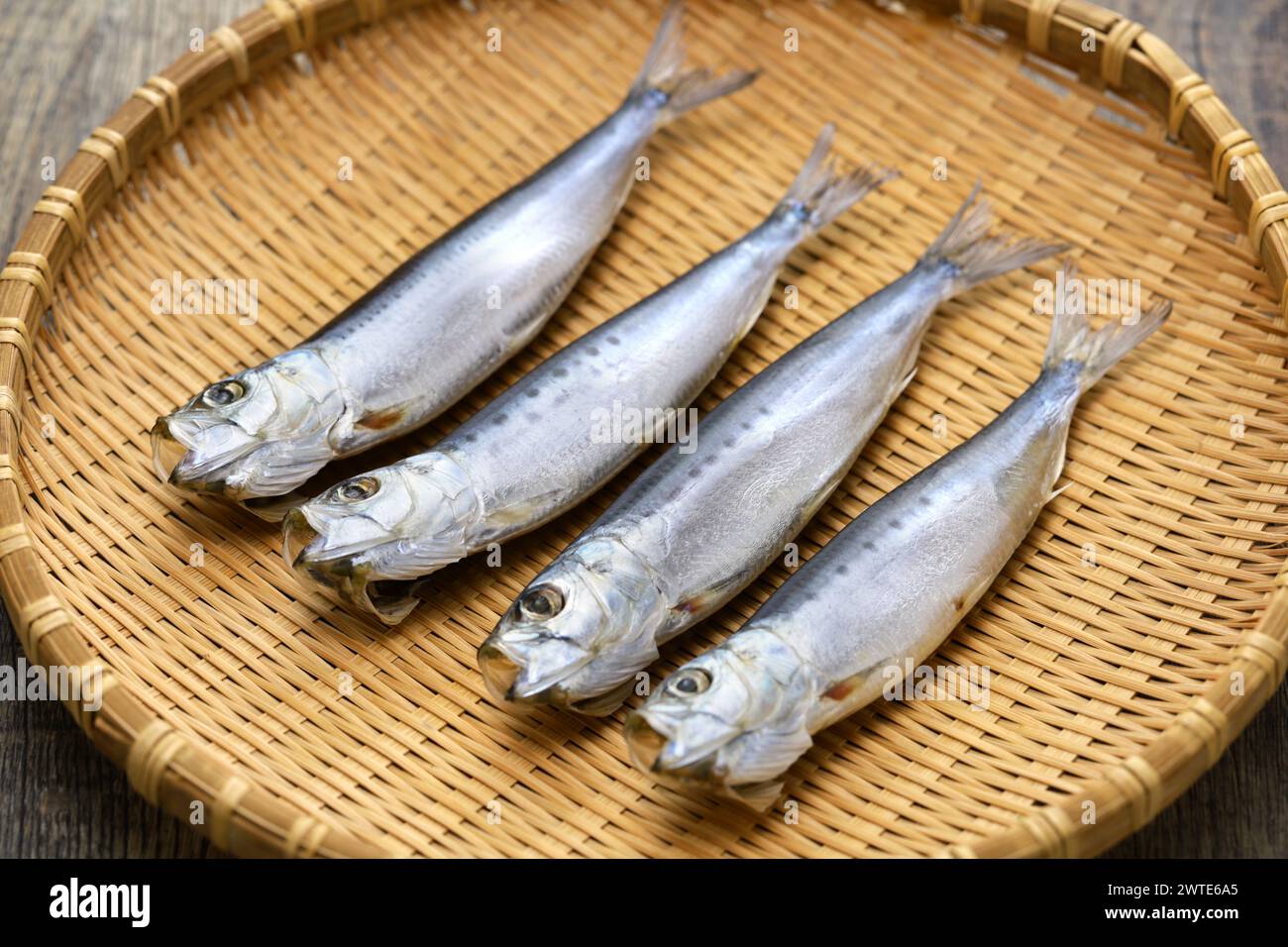 Iwashi marubosi ( semi-dried Japanese sardines ) isolated on a bamboo ...