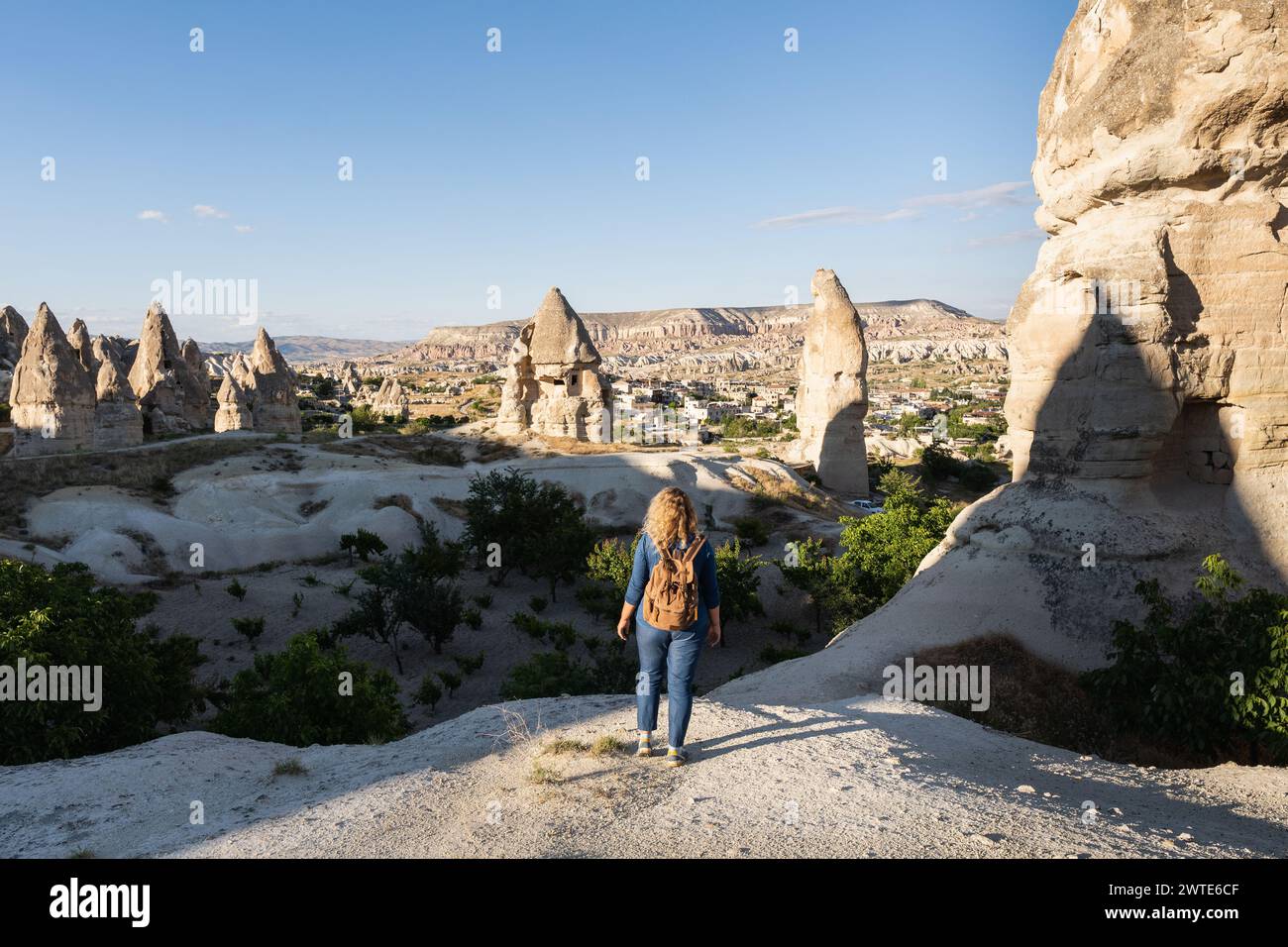 Woman travelling in Cappadocia, exploring fairy chimney valley in ...