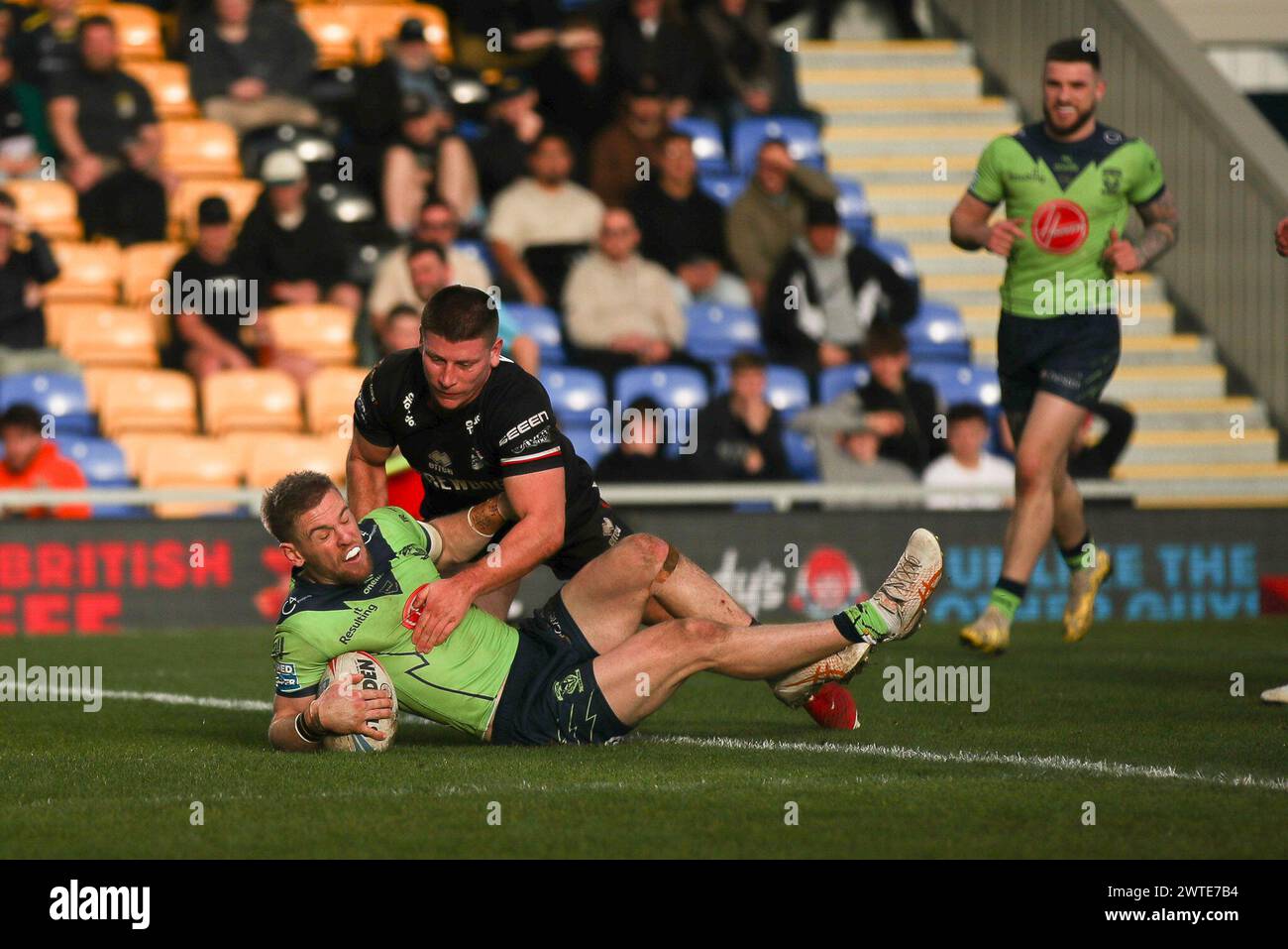 London, UK. 17th Mar, 2024. Matt Dufty of Warrington Wolves scores a ...