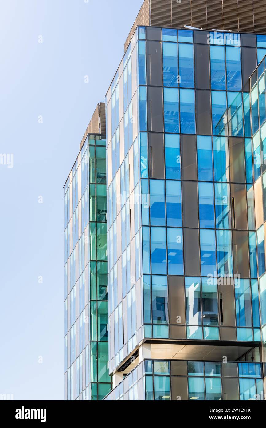 Detail of a modern office building. Glass building office in the center ...