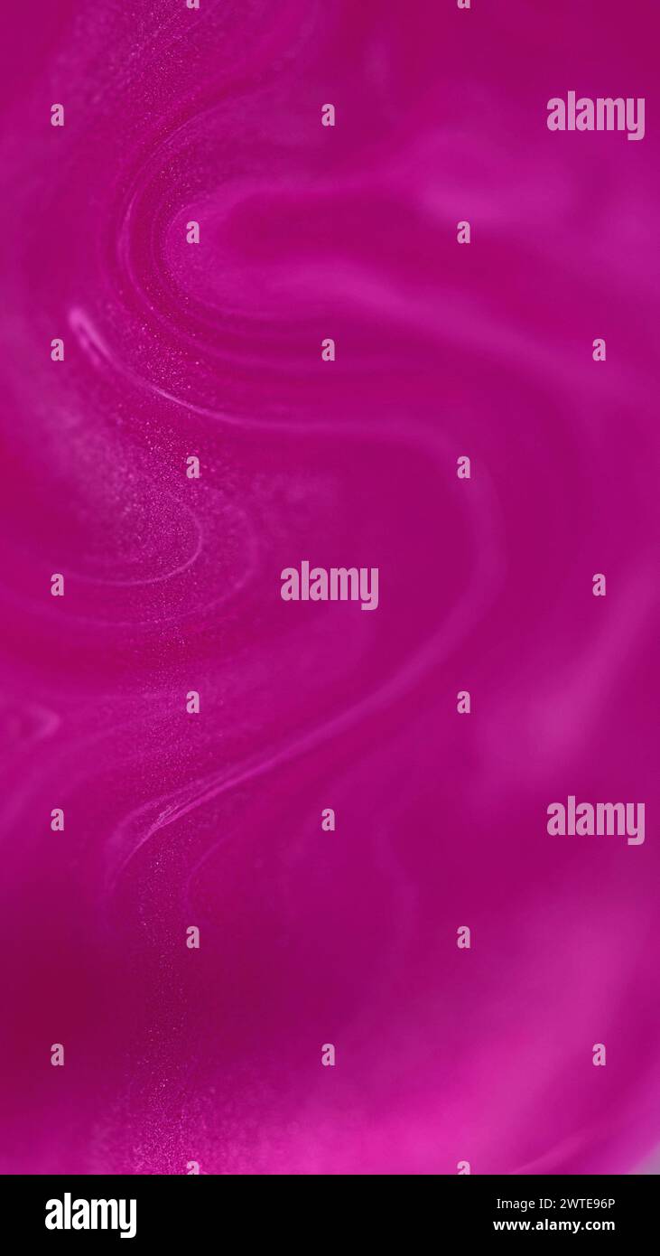 Shimmering paint ink flow neon pink acrylic stream Stock Photo - Alamy
