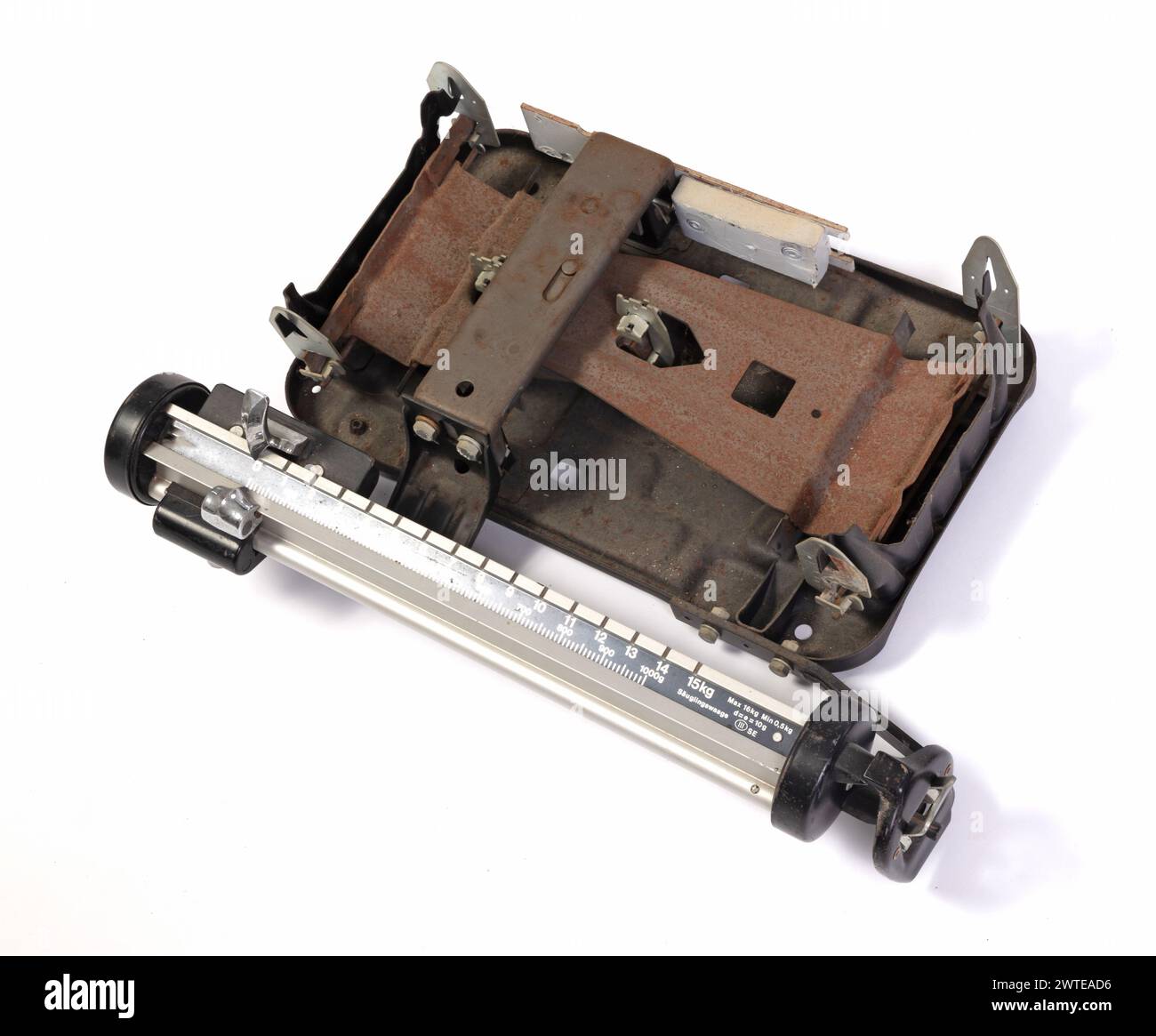 Part of broken baby weight scales, isolated on white Stock Photo - Alamy