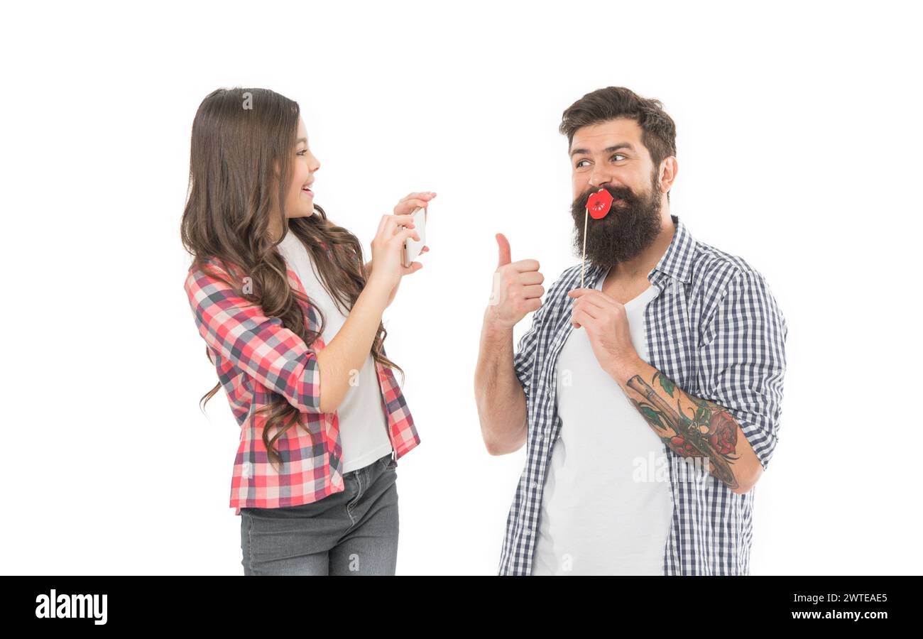 Happy little girl hold smartphone or mobile phone white background ...