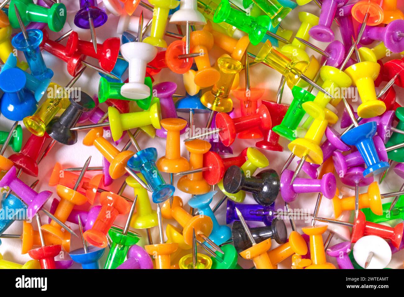 Many colorful push pins, isolated, full frame Stock Photo - Alamy
