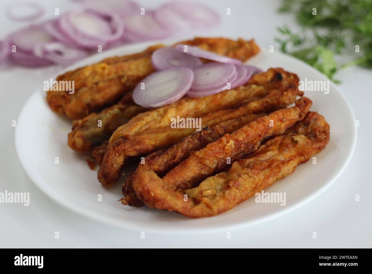 Golden crispy Bombil fish fry, delectable seafood dish popular in ...