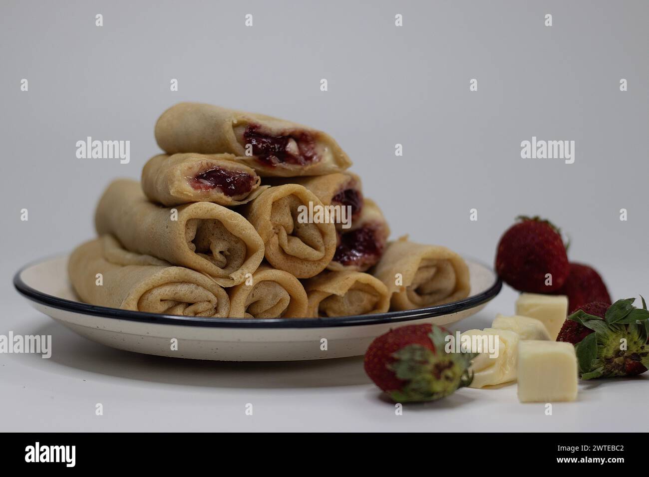 Strawberry cheese crepe rolls hi-res stock photography and images - Alamy
