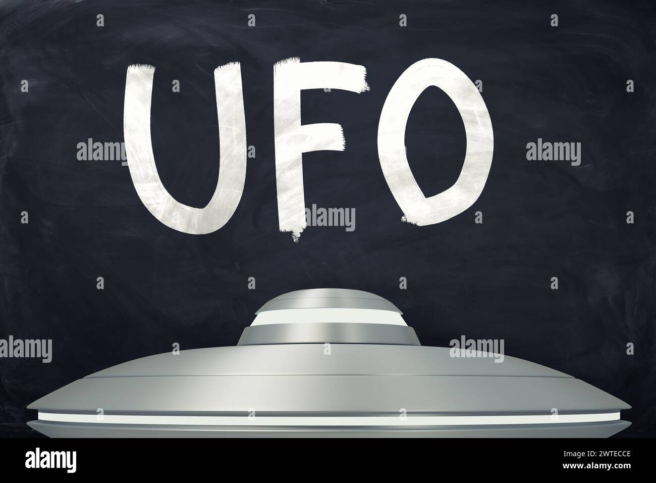 UFO with UFO text on blackboard Stock Photo - Alamy