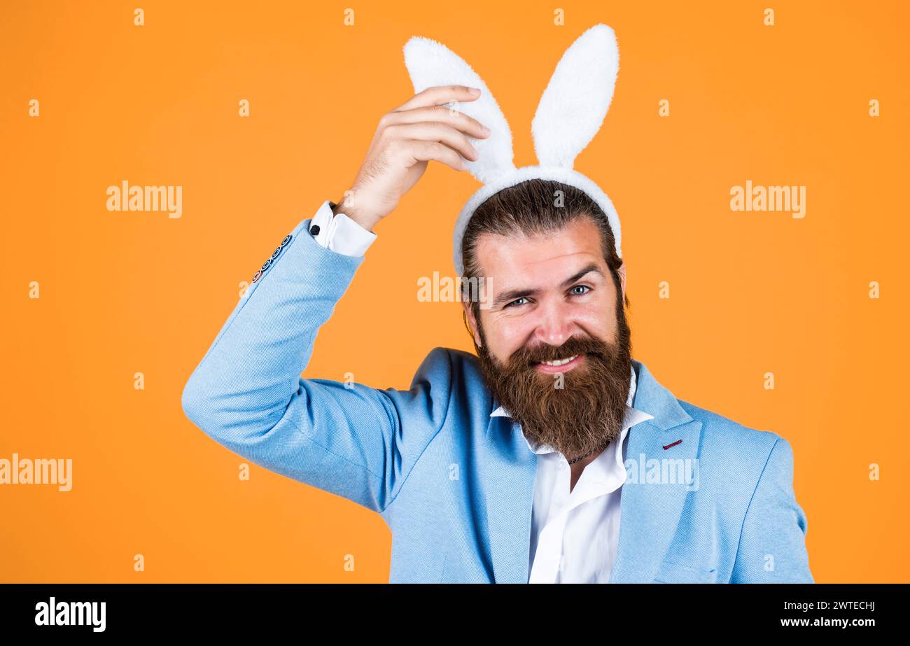 Man in rabbit ears. Preparation for Easter. concept of egg hunt. Easter ...