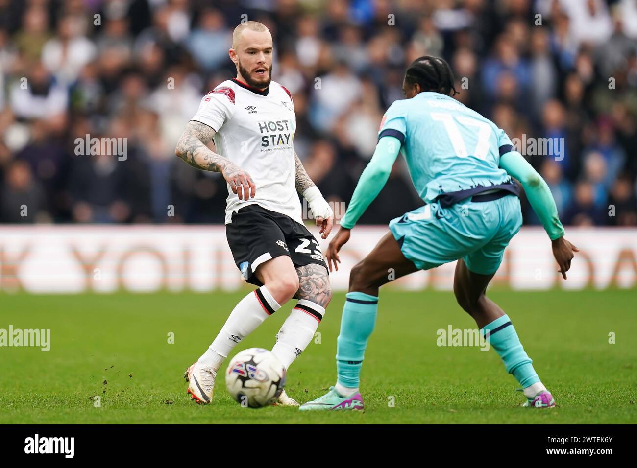Derby County's Joe Ward challenges Bolton Wanderers Nathanael Obeta ...