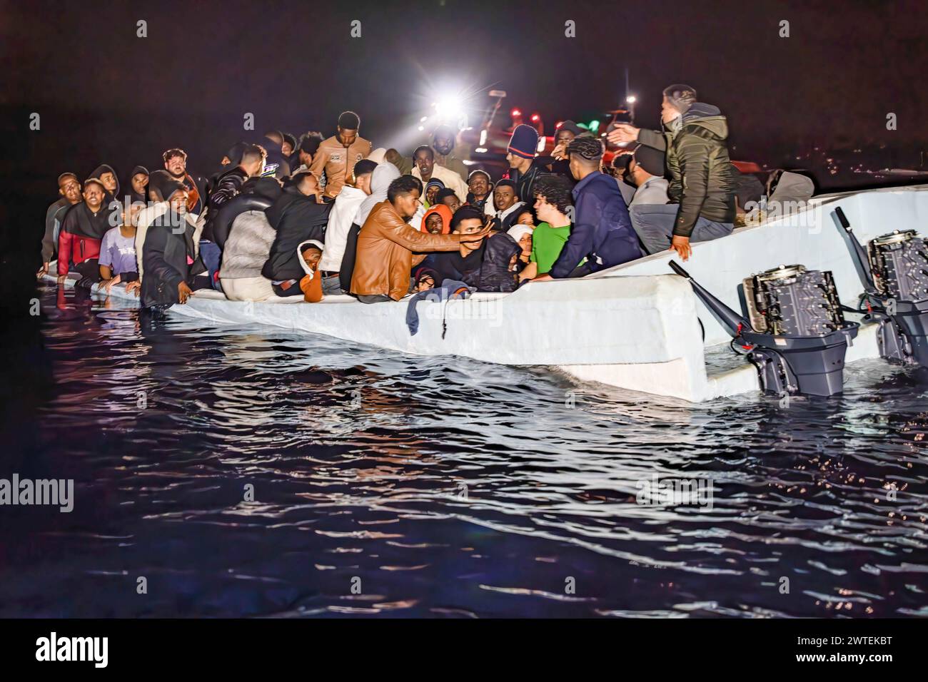 Libyan Sar Zone, Libya. 16th Mar, 2024. Migrants seen on a fiberglass ...