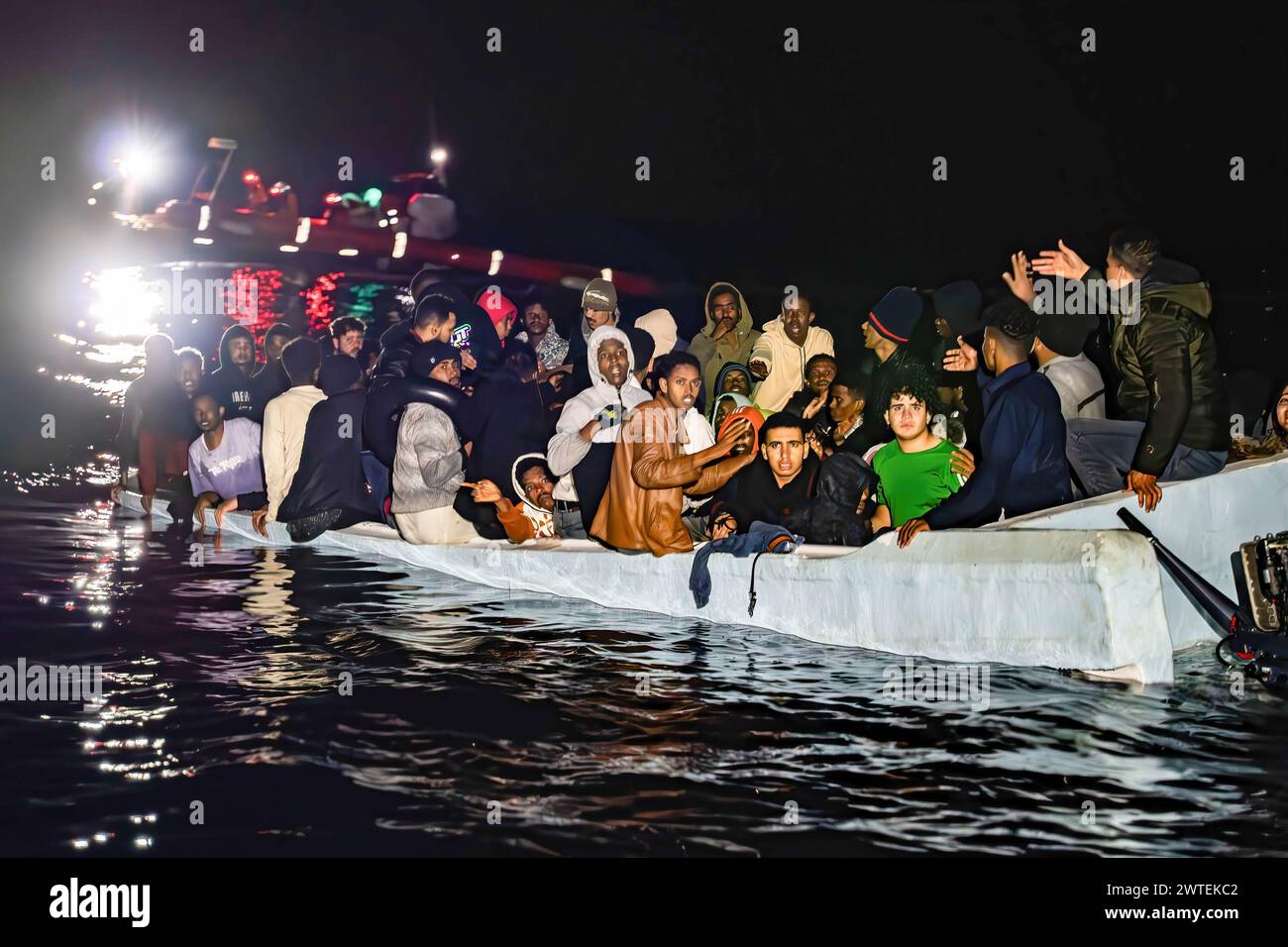 Libyan Sar Zone, Libya. 16th Mar, 2024. Migrants seen on a fiberglass ...
