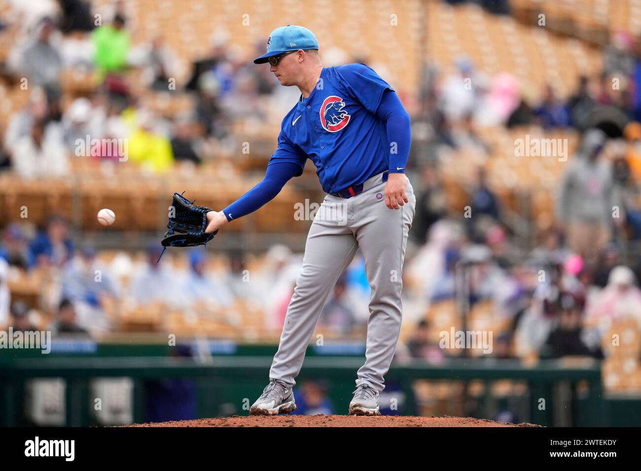 Chicago Cubs starting pitcher Jordan Wicks reaches for the ball during ...