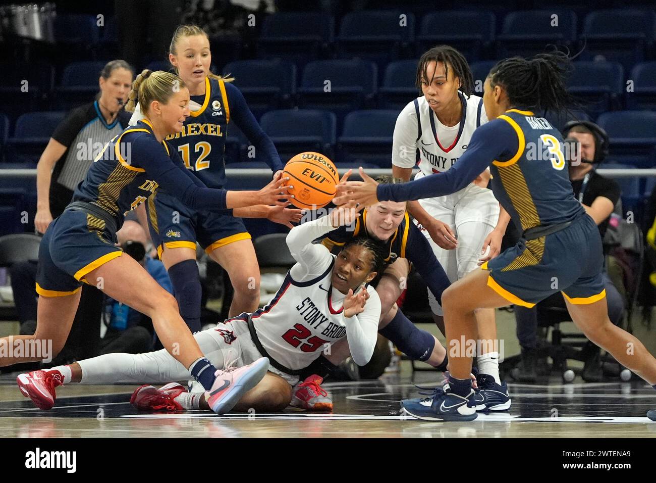 Stony Brook forward Khari Clark (25) and Drexel forward Hetta Saatman ...