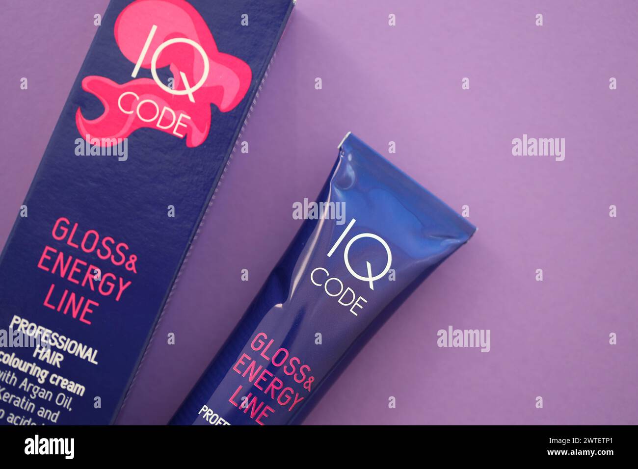KYIV, UKRAINE - OCTOBER 31, 2023 Tube of IQ Code Gloss and Energy Line colorizer cream for hair ...