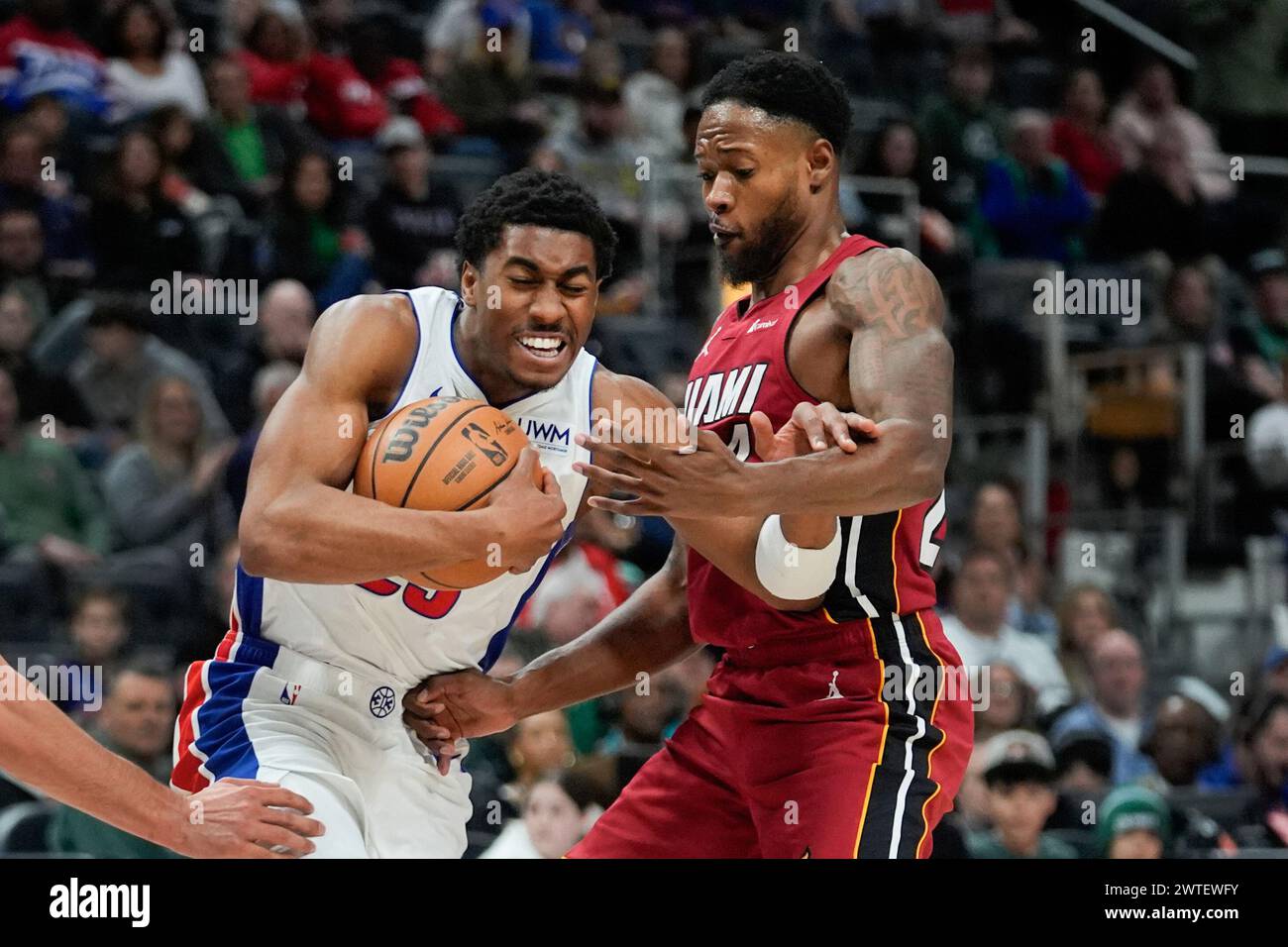 Detroit Pistons guard Jaden Ivey, left, drives on Miami Heat forward ...