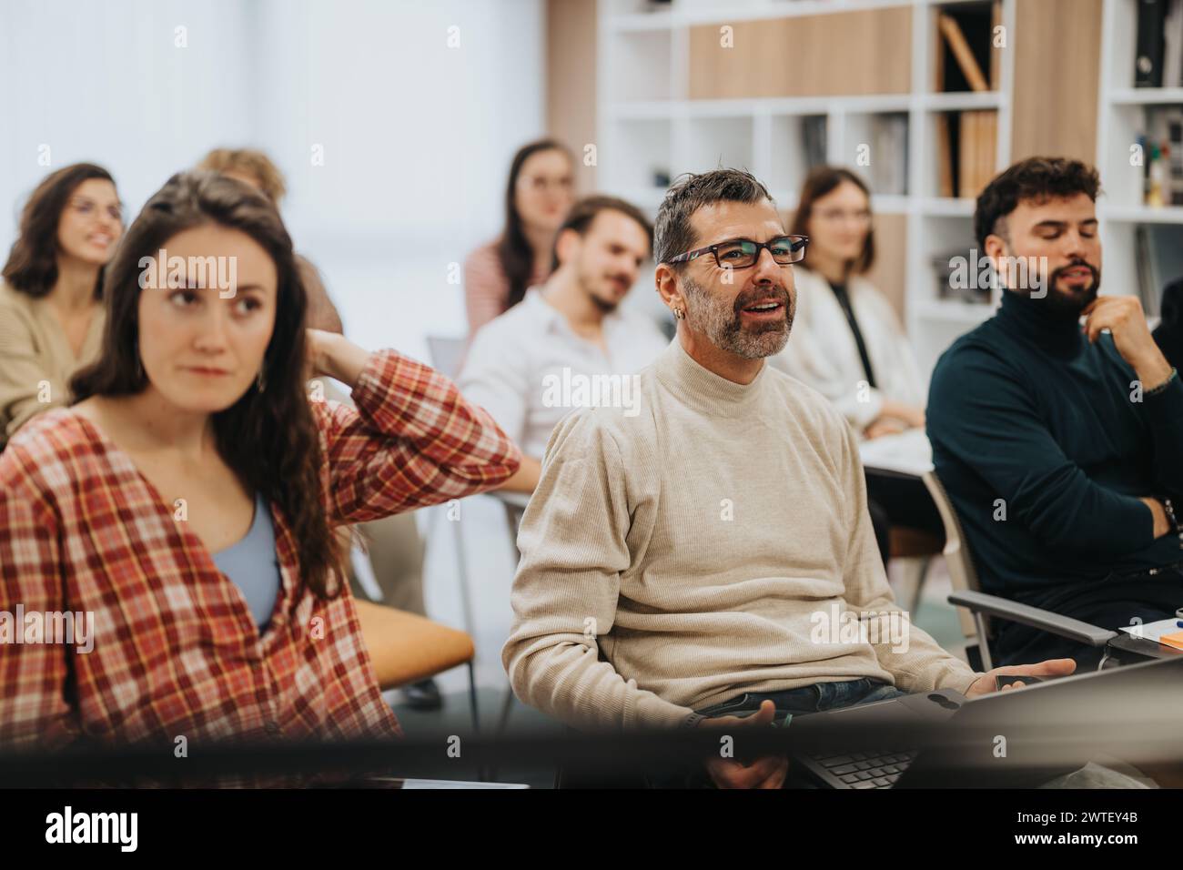 Corporate group engaged in learning hi-res stock photography and images ...