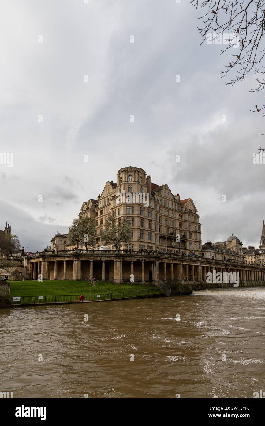Majestic old building on cloudy day with rising river water levels ...