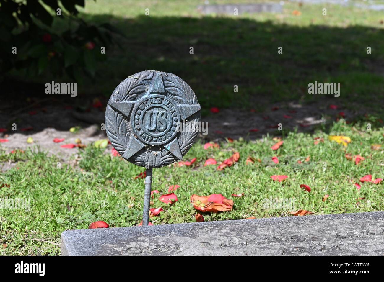 A WWI bronze star by a grave in the historic cemetery behind the Holy ...