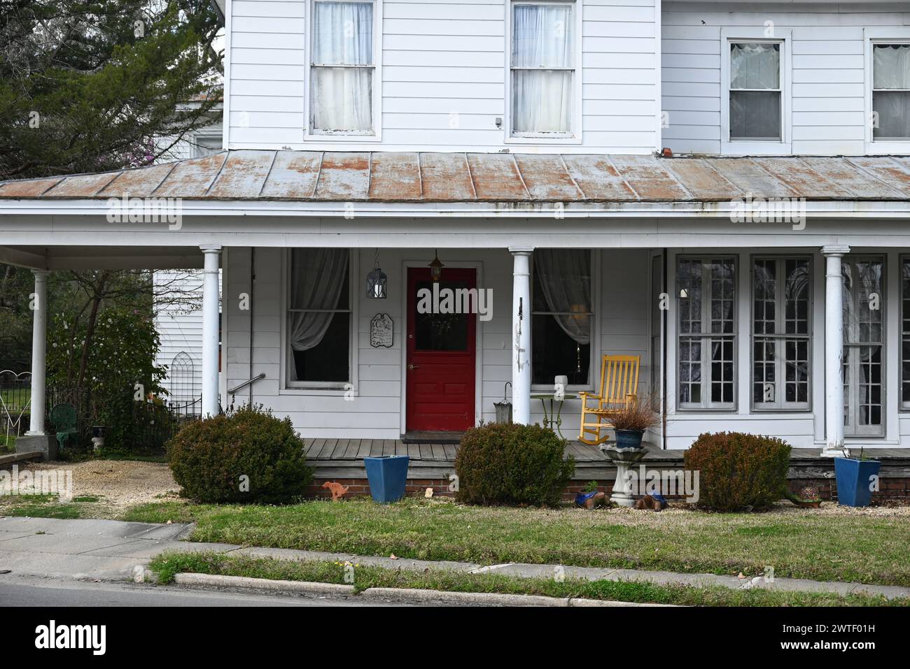 Front porch with a red door to a home in the small town of Hertford ...