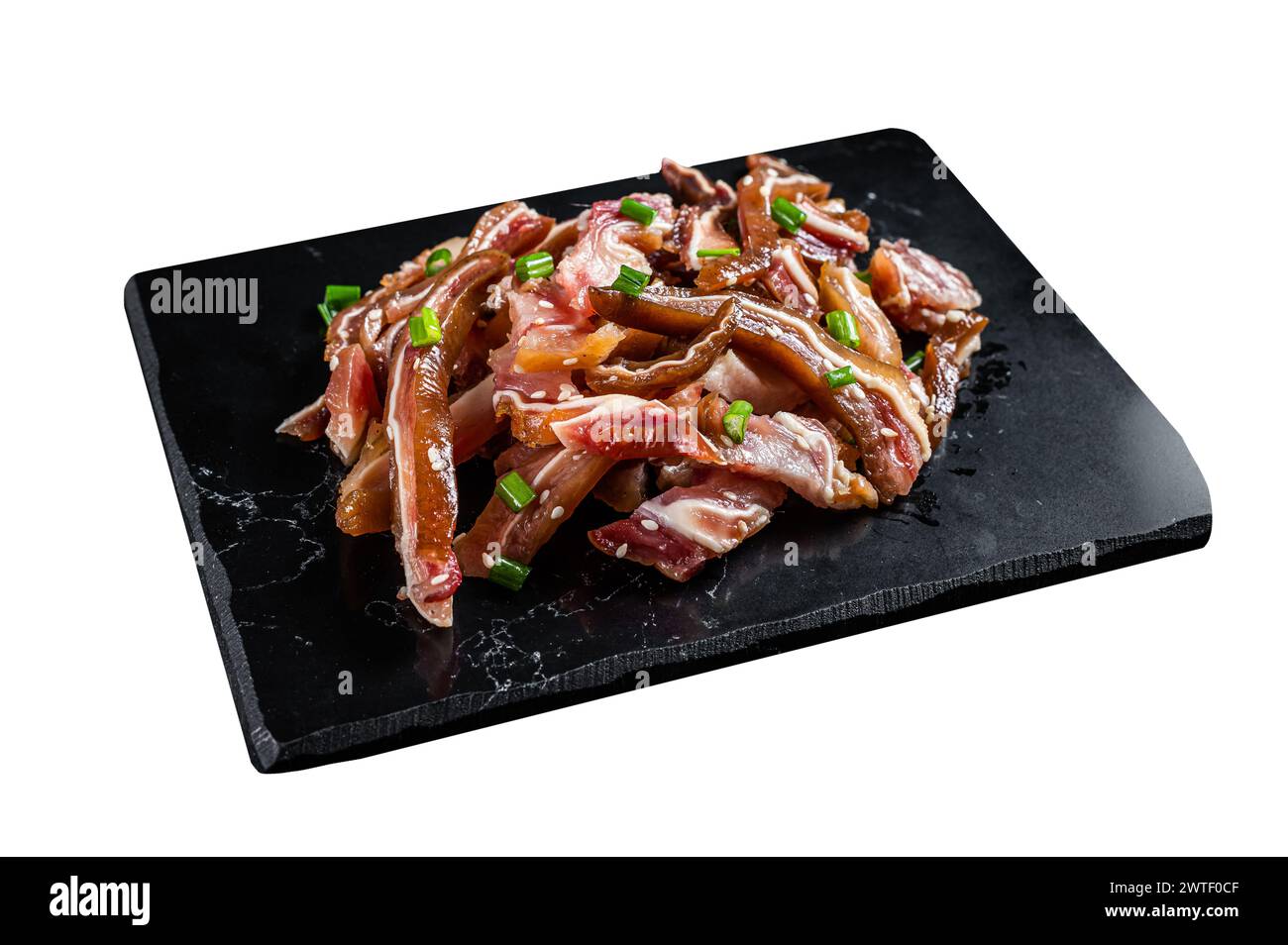 Fried pig ears with sesame seeds and green onions. Fried pork ears in ...