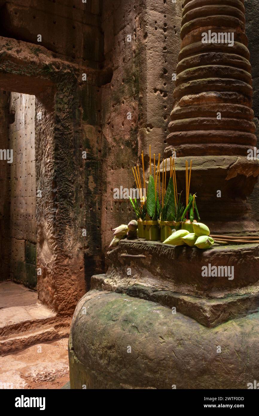 Stupa and flower offerings inside the ruins of Prasat Preah Khan temple ...