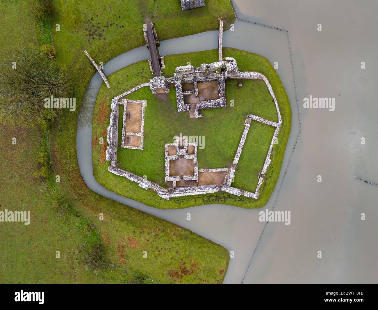 Overhead shot of medieval castle ruins encircled by water, showcasing ...