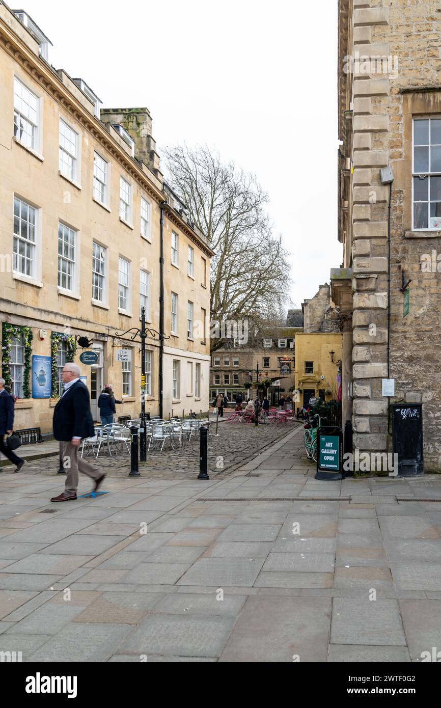 Lively city street corner with pedestrians and historical architecture ...