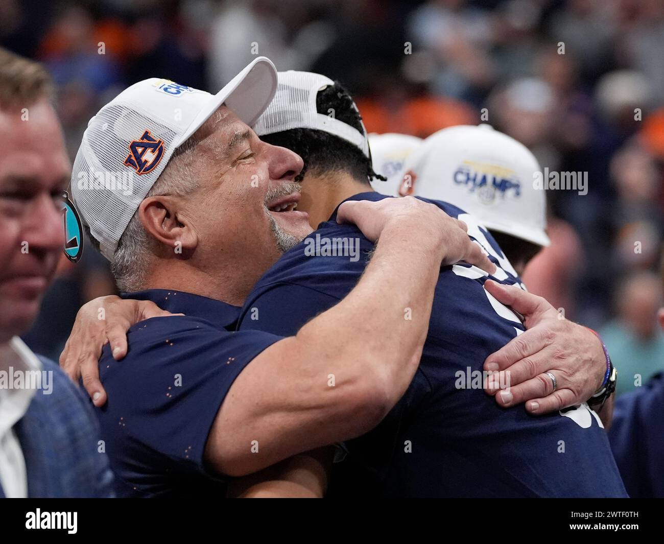 Auburn Head Coach Bruce Pearl Hugs One Of His Players After Defeating