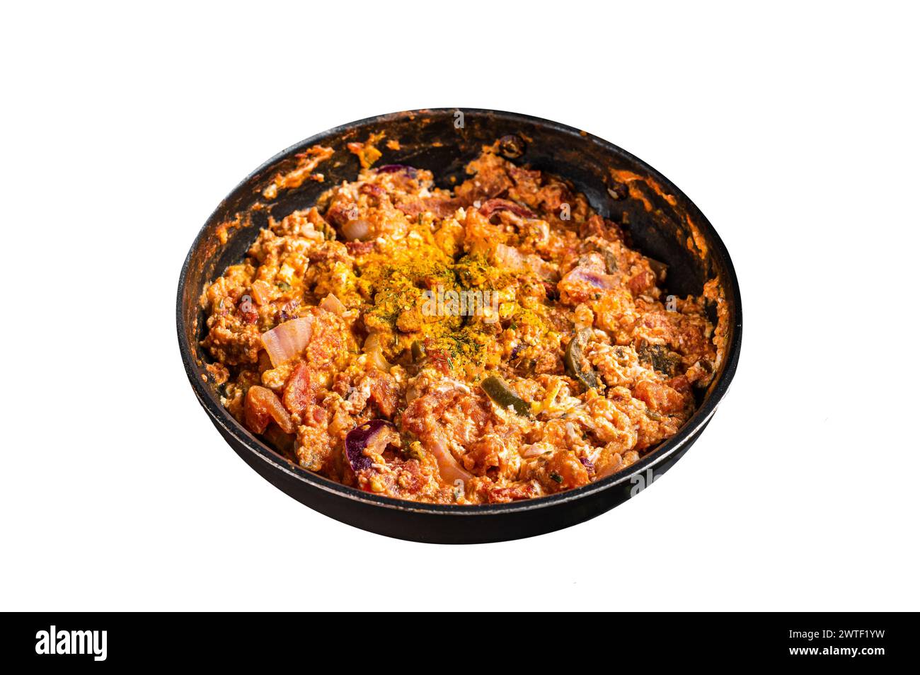 Turkish Menemen omelet in a frying pan. Isolated on white background ...