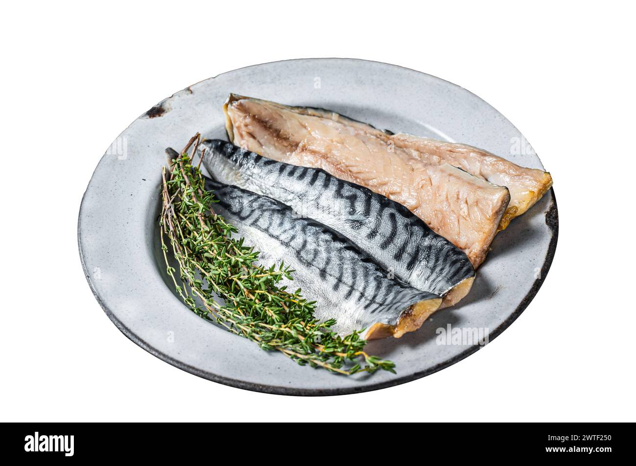 Salty sliced mackerel fillet fish in a plate with herbs. Isolated on ...