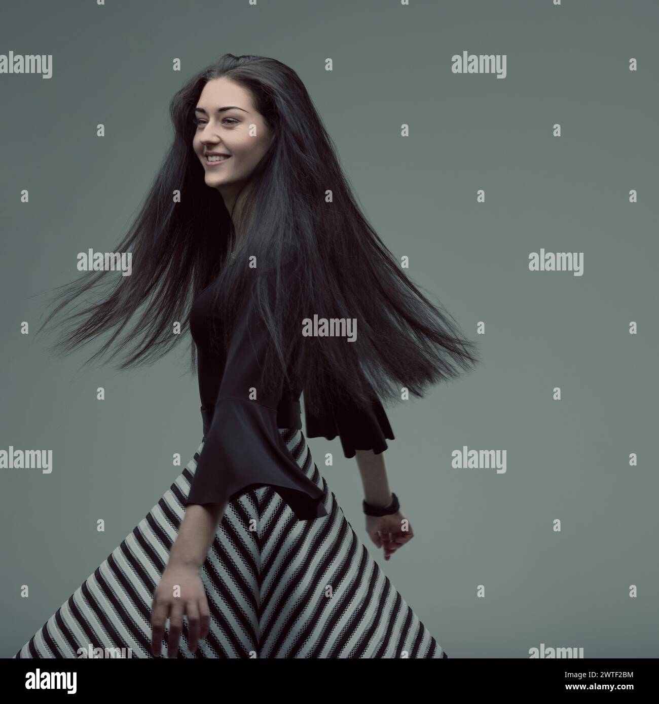 The woman’s playful movement exudes a zest for fashion and contagious ...